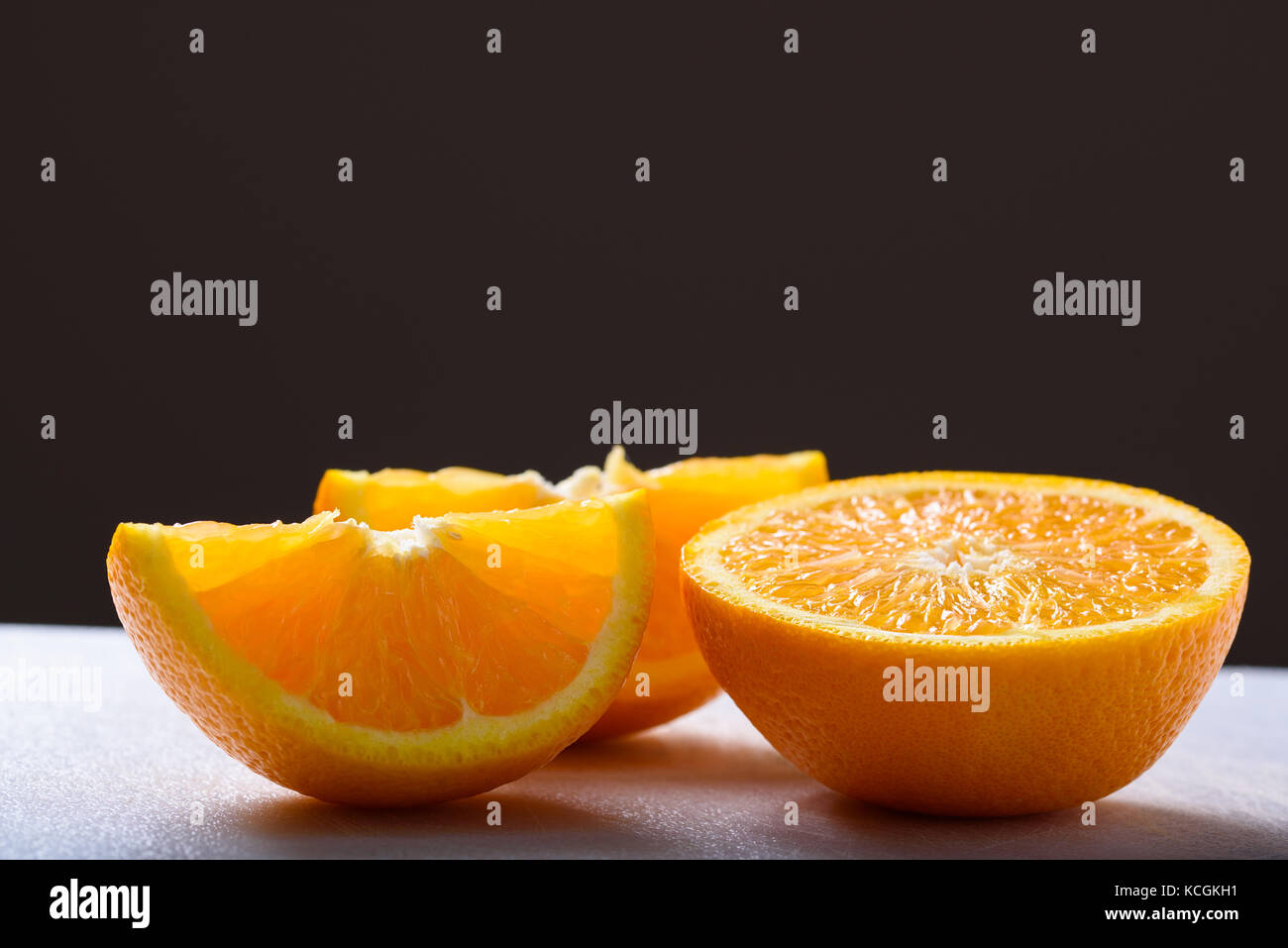 Sliced sweet orange; Orange halves and quarters Stock Photo - Alamy