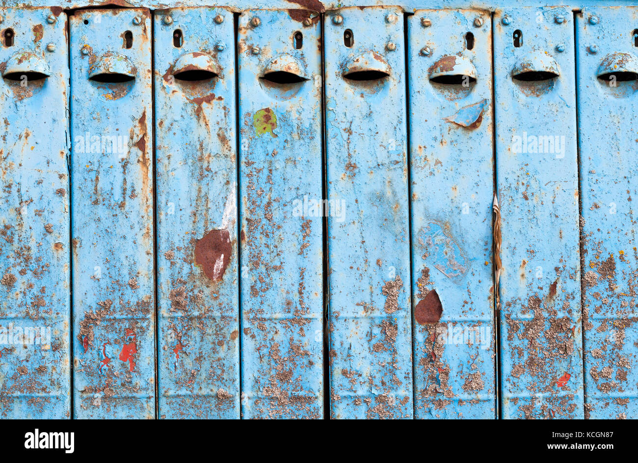 Old blue mailbox for several houses. The box is made of metal and ...