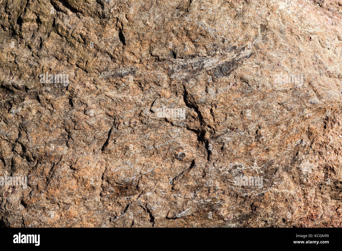 old stone has many irregularities and a heterogeneous structure. Photo ...