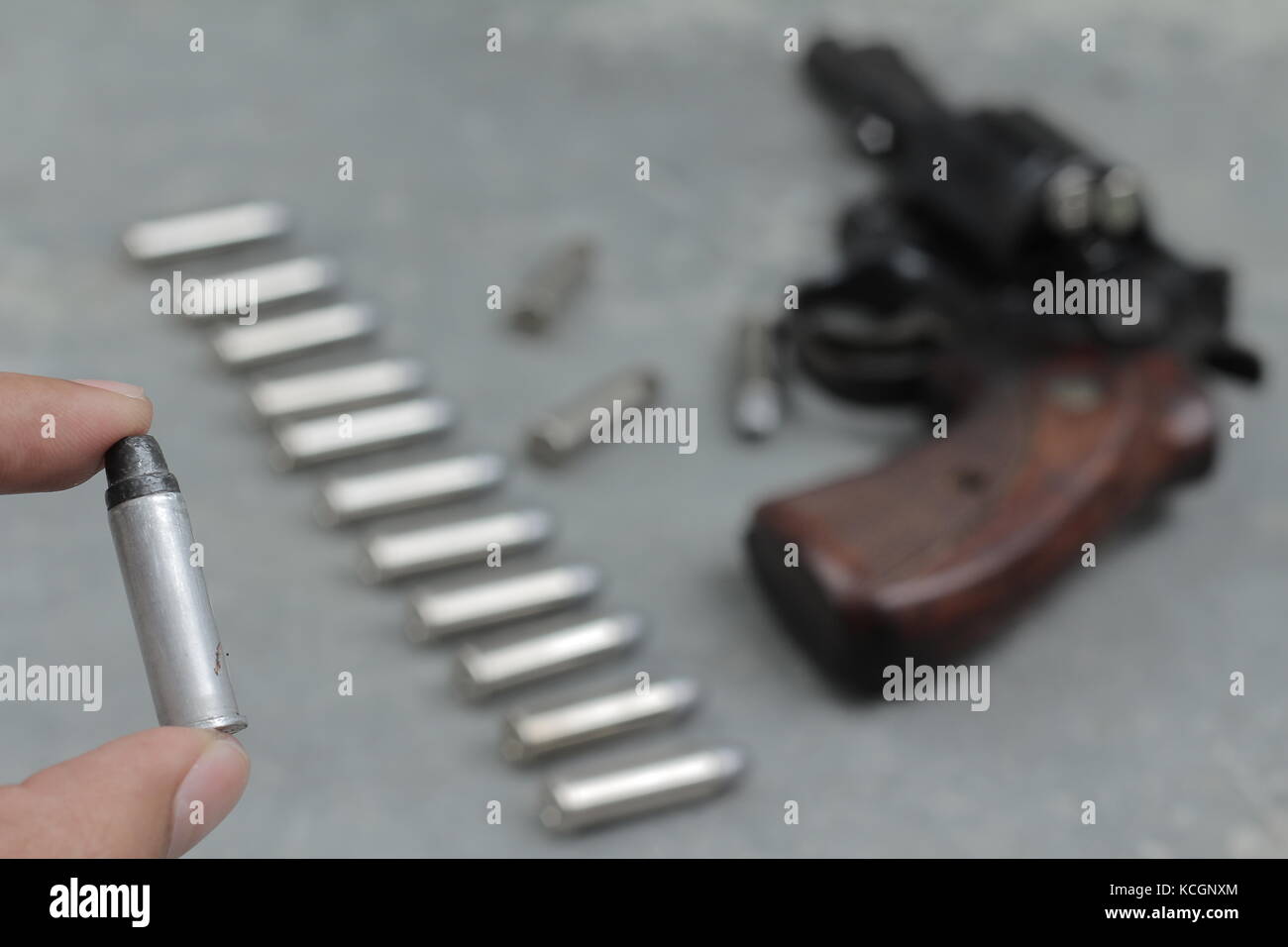 bullet and gun revolver Stock Photo - Alamy