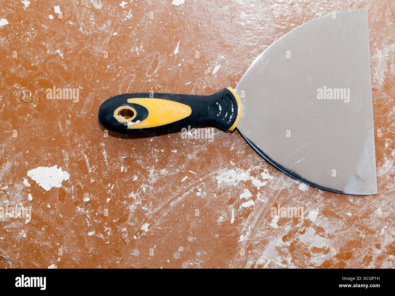 used metal spatula lying on the floor for construction work Stock Photo ...