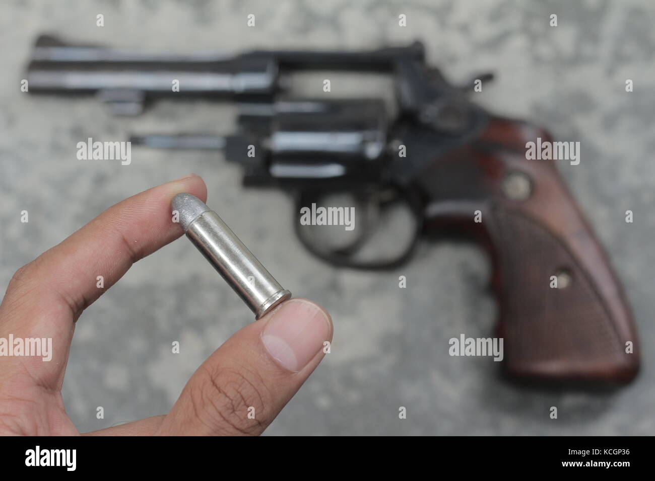 bullet and gun revolver Stock Photo - Alamy