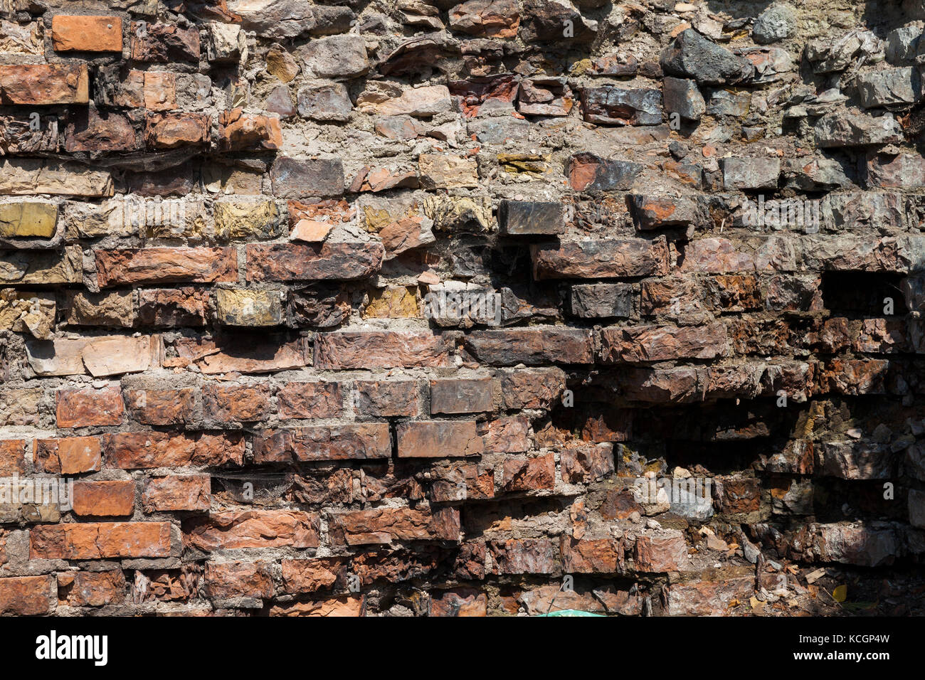 part of the destroyed brick wall of the structure. Photographed close ...