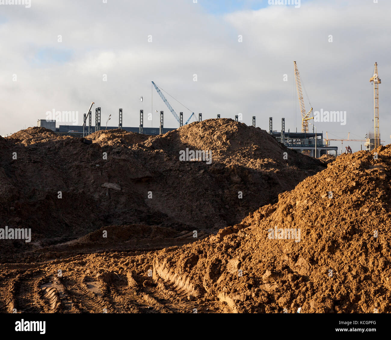 a photo taken at the site of construction of a new building. Dirt on ...