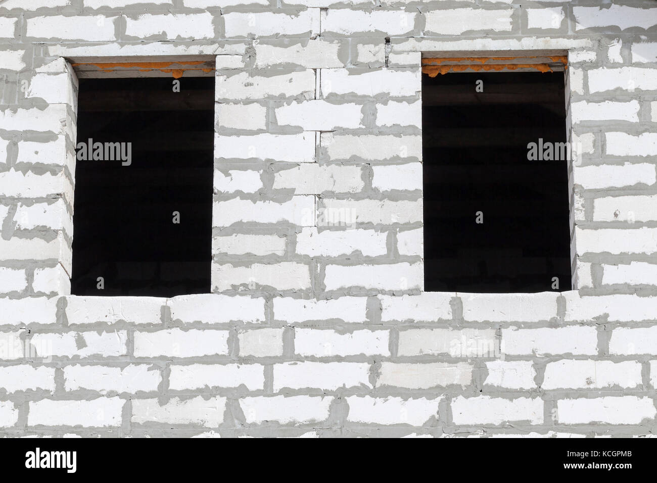 Two openings for windows in the building under construction from gas ...