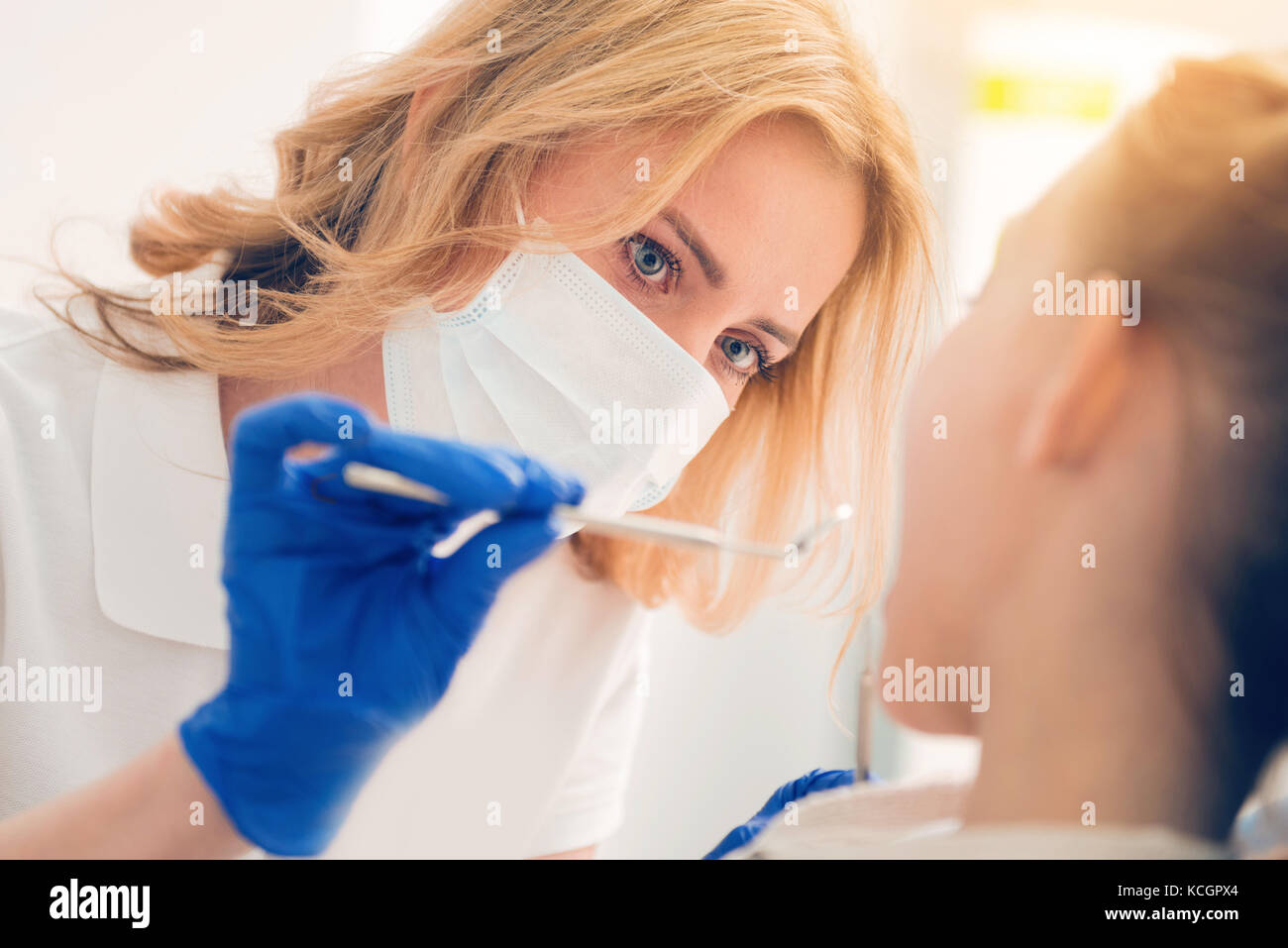 Close up of dental professional examining teeth of patient Stock Photo ...
