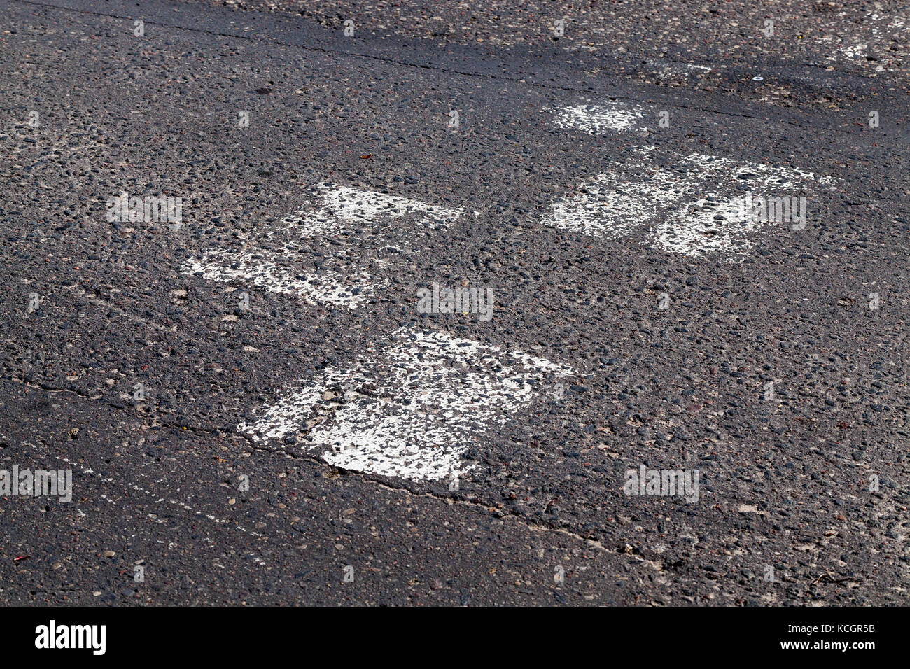 erased lines and road markings, painted on asphalt. close-up Stock ...