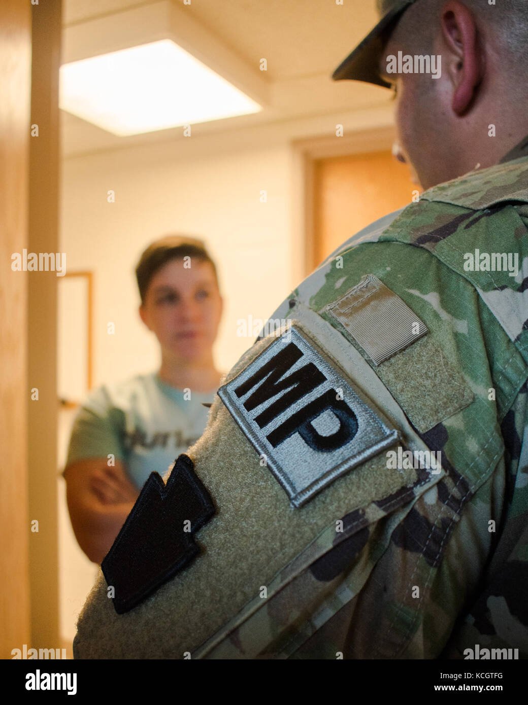 U.S. Army Sgt. Arthur Kohler interviews a suspect while responding to a ...