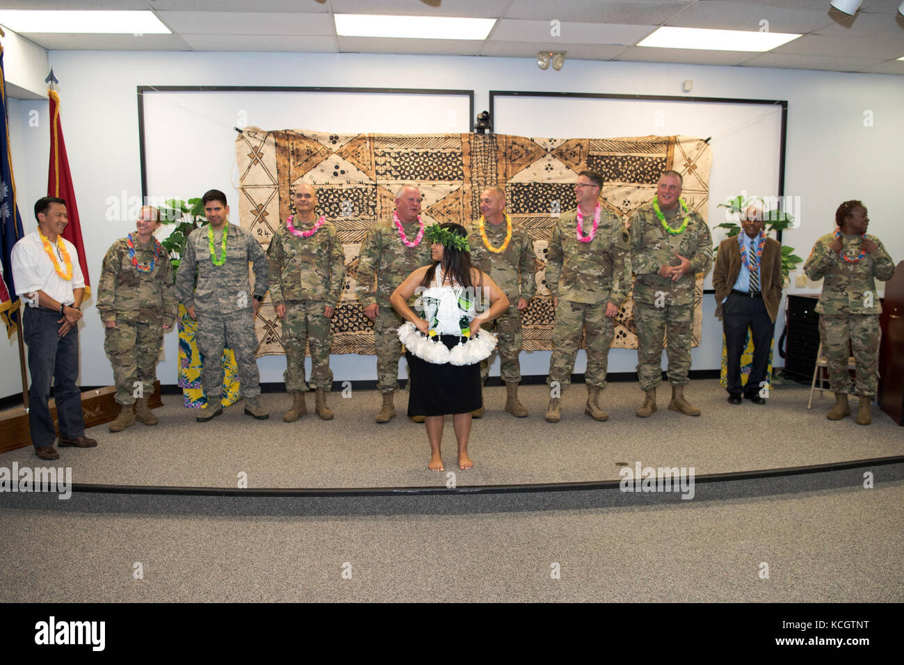 Members of the Pacific Nesian Dance Group teach individuals from the ...