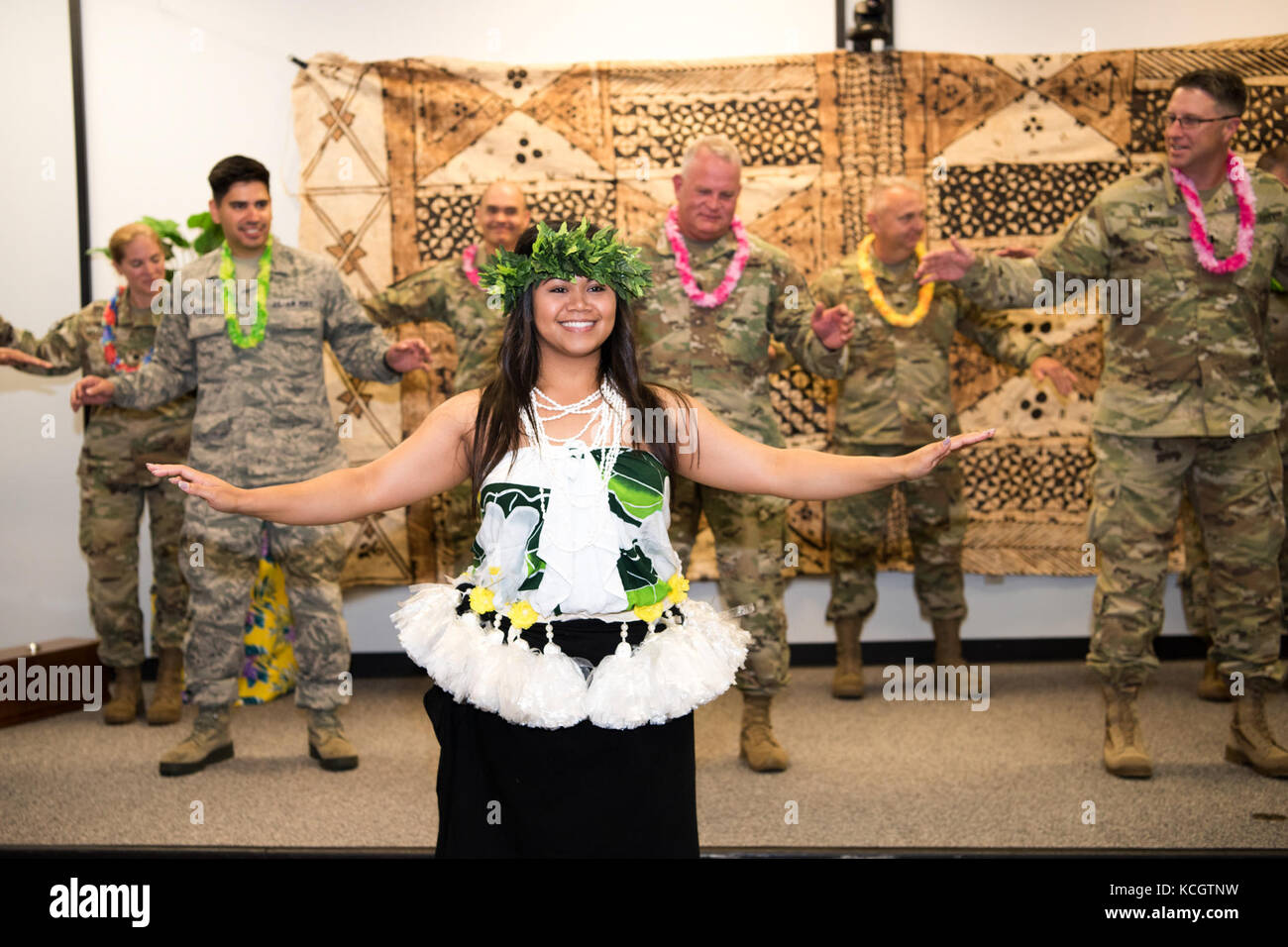 Members of the Pacific Nesian Dance Group teach individuals from the ...