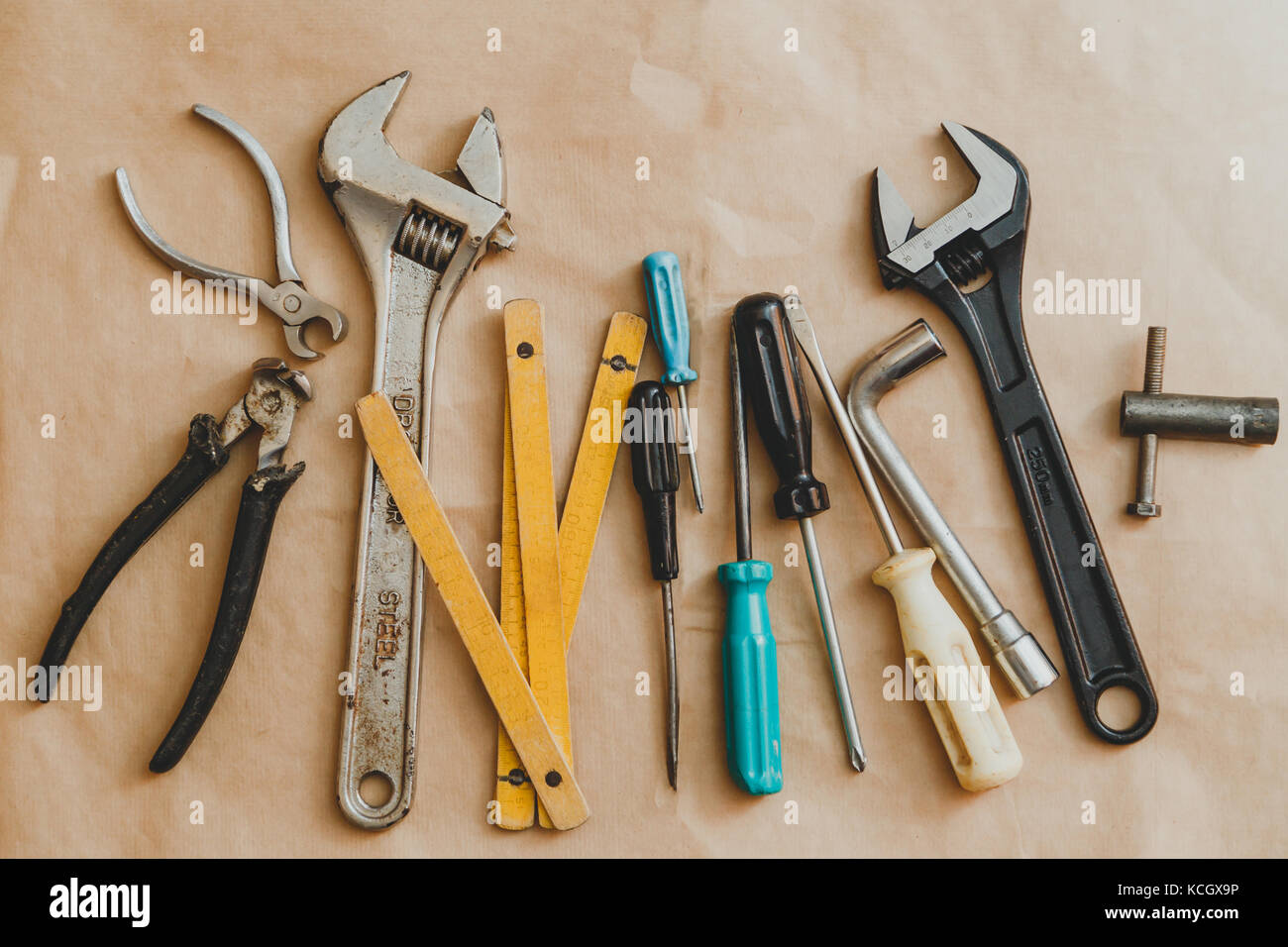Set of hand tools on craft paper background Stock Photo - Alamy