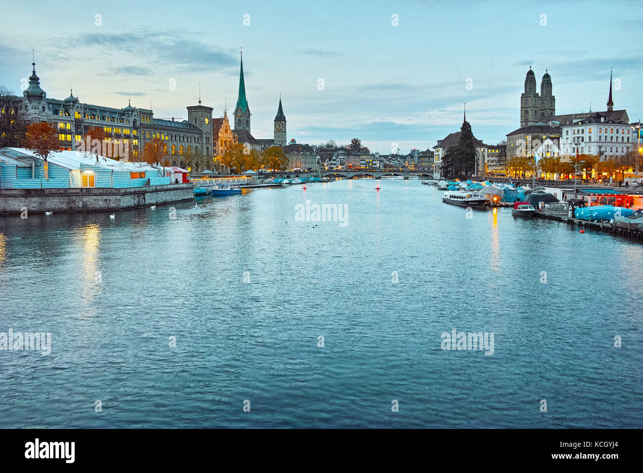 Sunset panorama of city of Zurich and reflection in Limmat River ...