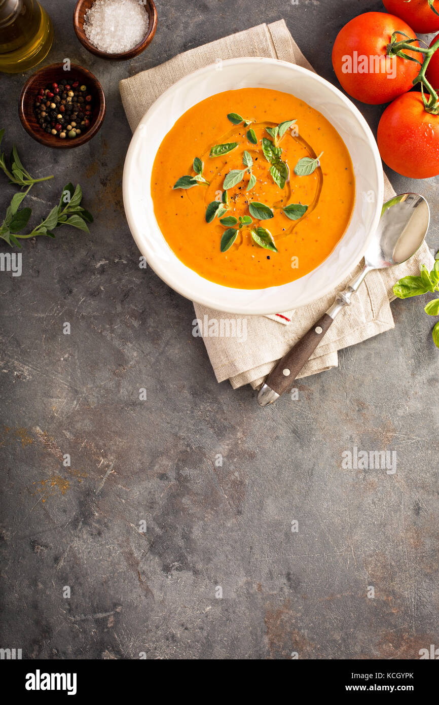 Tomato soup with olive oil and herbs Stock Photo - Alamy
