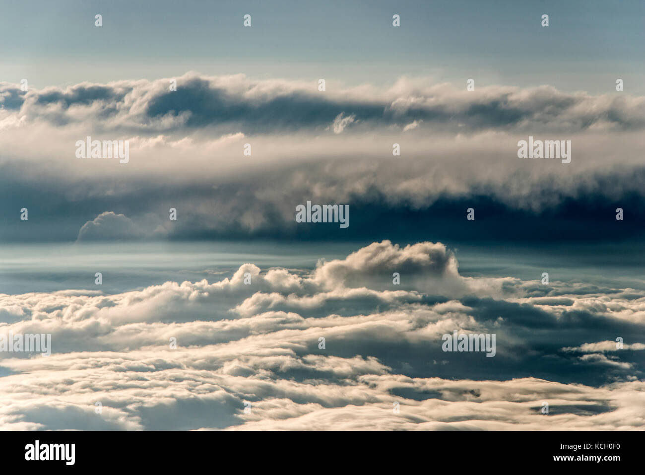 Clouds divided sky during sunset colorful light against dark contrasts ...