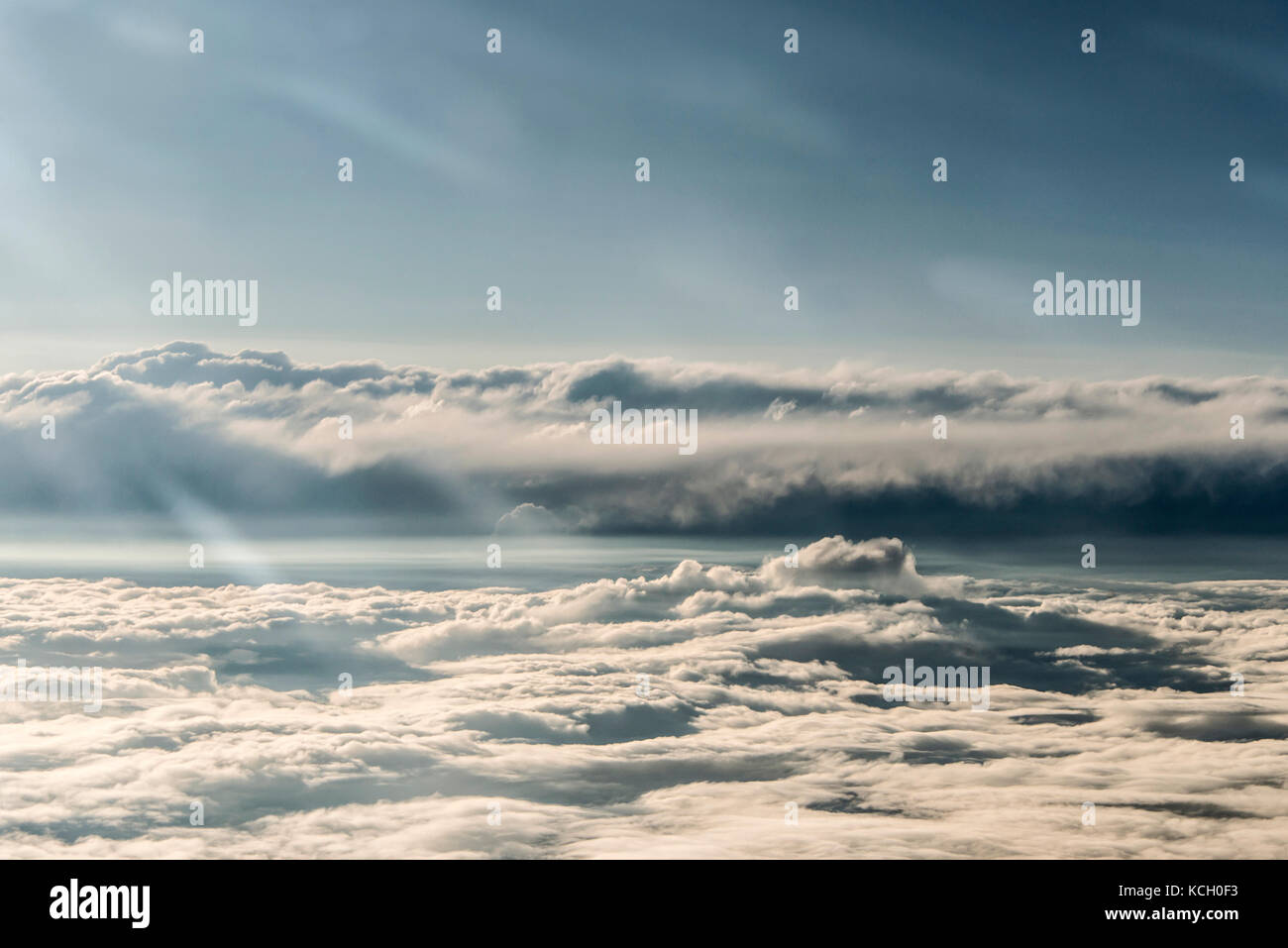 Clouds divided sky during sunset colorful light against dark contrasts ...