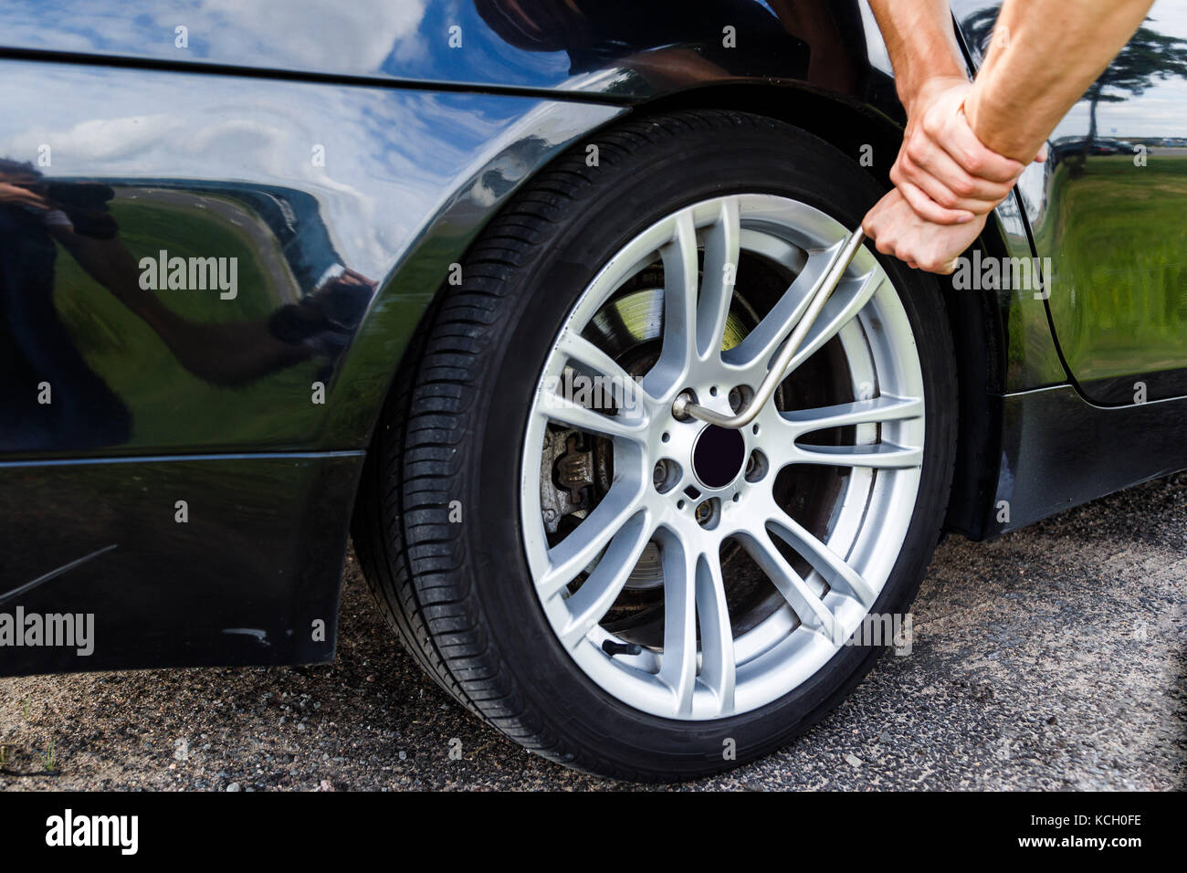 Car wheel changed by Wrench on the road while a trip Stock Photo - Alamy