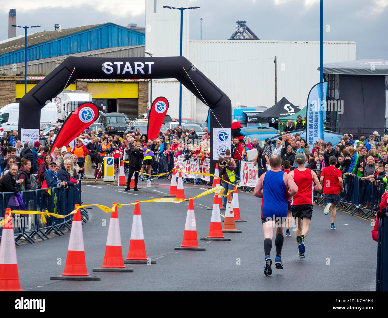 Redcar Half Marathon 1st October 2017 runners passing a crowd as reach ...