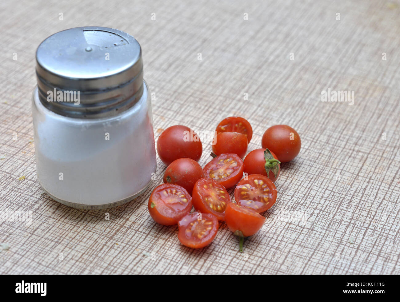 fresh cherry tomato and salt on a table,image of a Stock Photo - Alamy