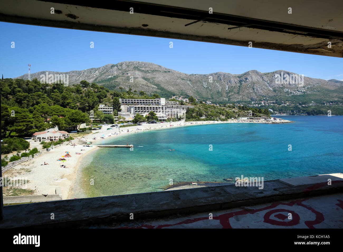A view of the sea beach and mountains from an abandoned old building in ...