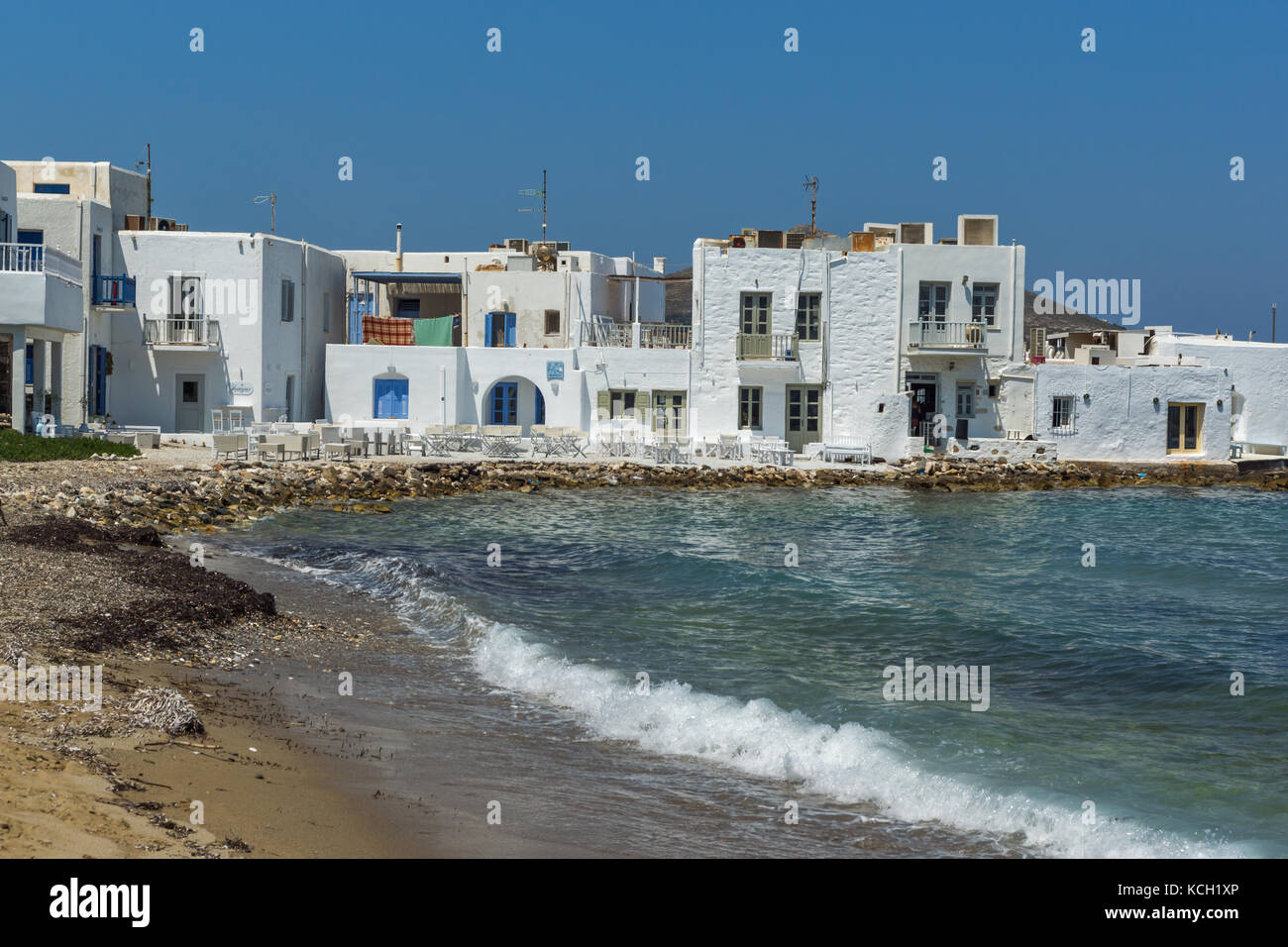 Old white house and Bay in Naoussa town, Paros island, Cyclades, Greece ...