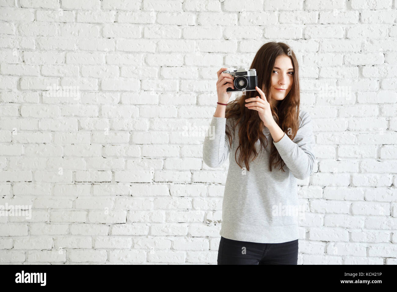 woman photographer holding a film camera in hands Stock Photo - Alamy