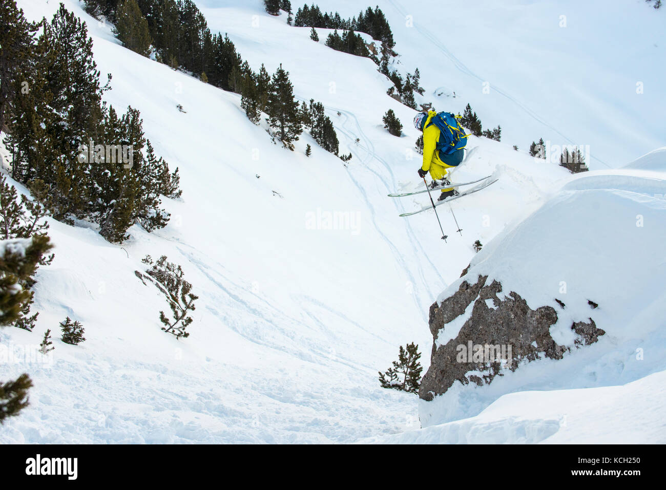 A skier jumps off a rock off piste in the French alpine resort of ...