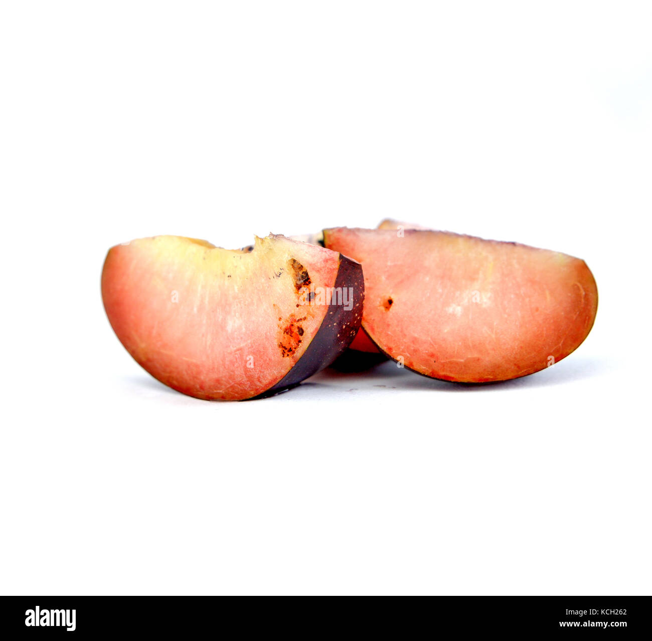 Plum slice with larva ,rottening fruit,image of a Stock Photo - Alamy