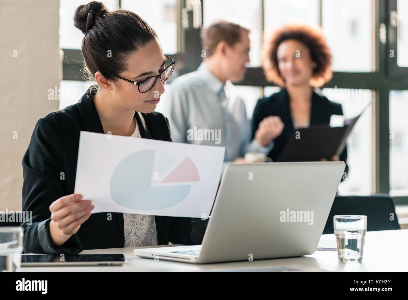 Women colleagues analyzing business data hi-res stock photography and ...