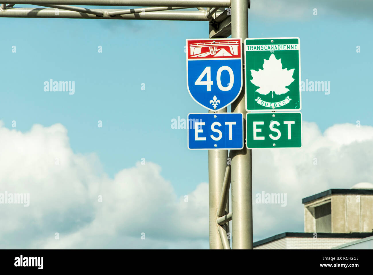 Signpost with green sign of the Trans Canada Highway east direction ...