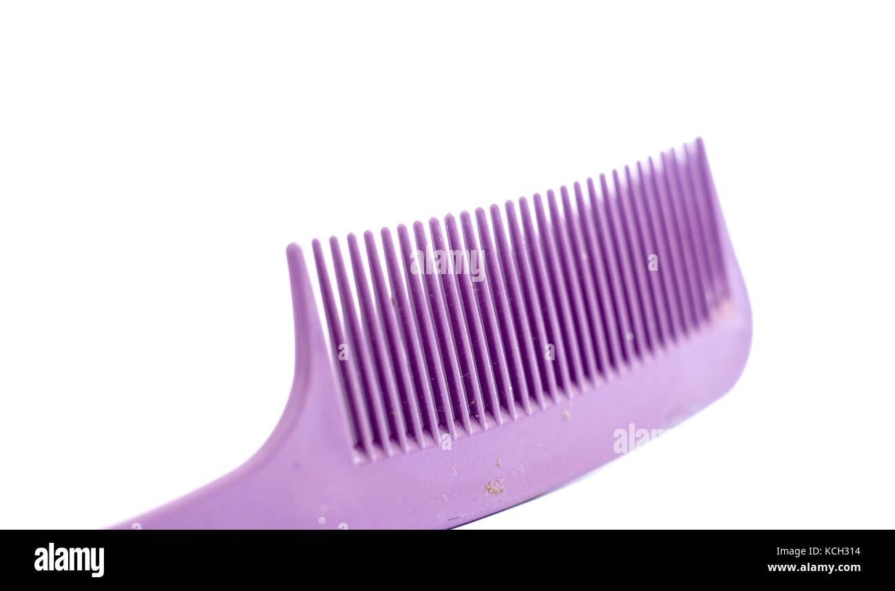 Violet plastic Hair Comb on white background, image of Stock Photo - Alamy