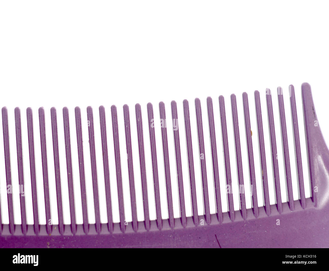 Violet plastic Hair Comb on white background, image of Stock Photo - Alamy