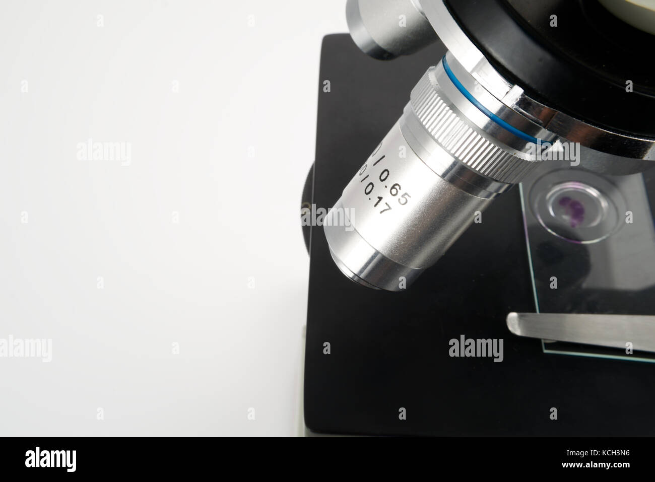 Close up of the lenses of a microscope on white background, Scientific ...