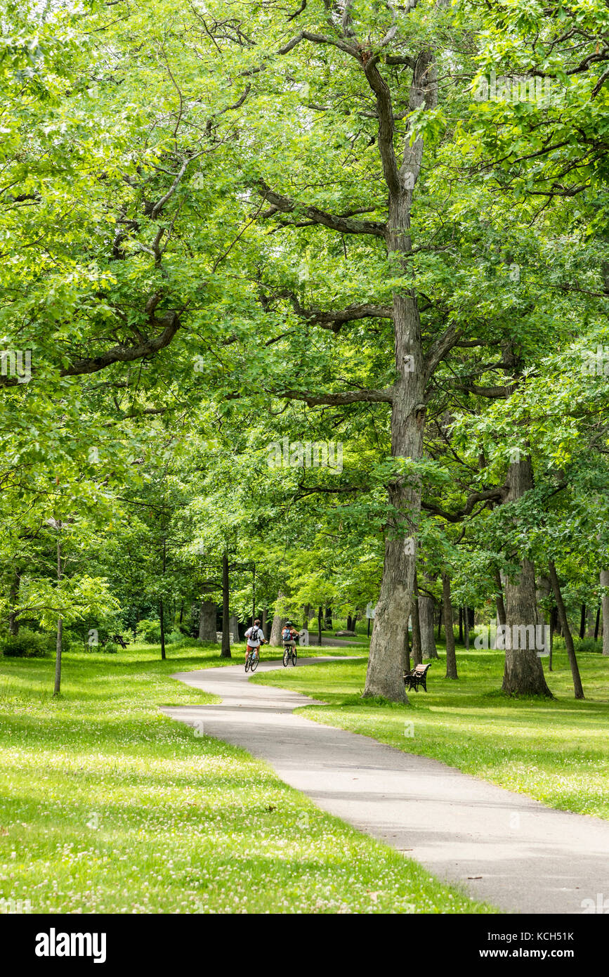 Bicycle riders enjoy the Niagara River Recreation Trail a paved path ...