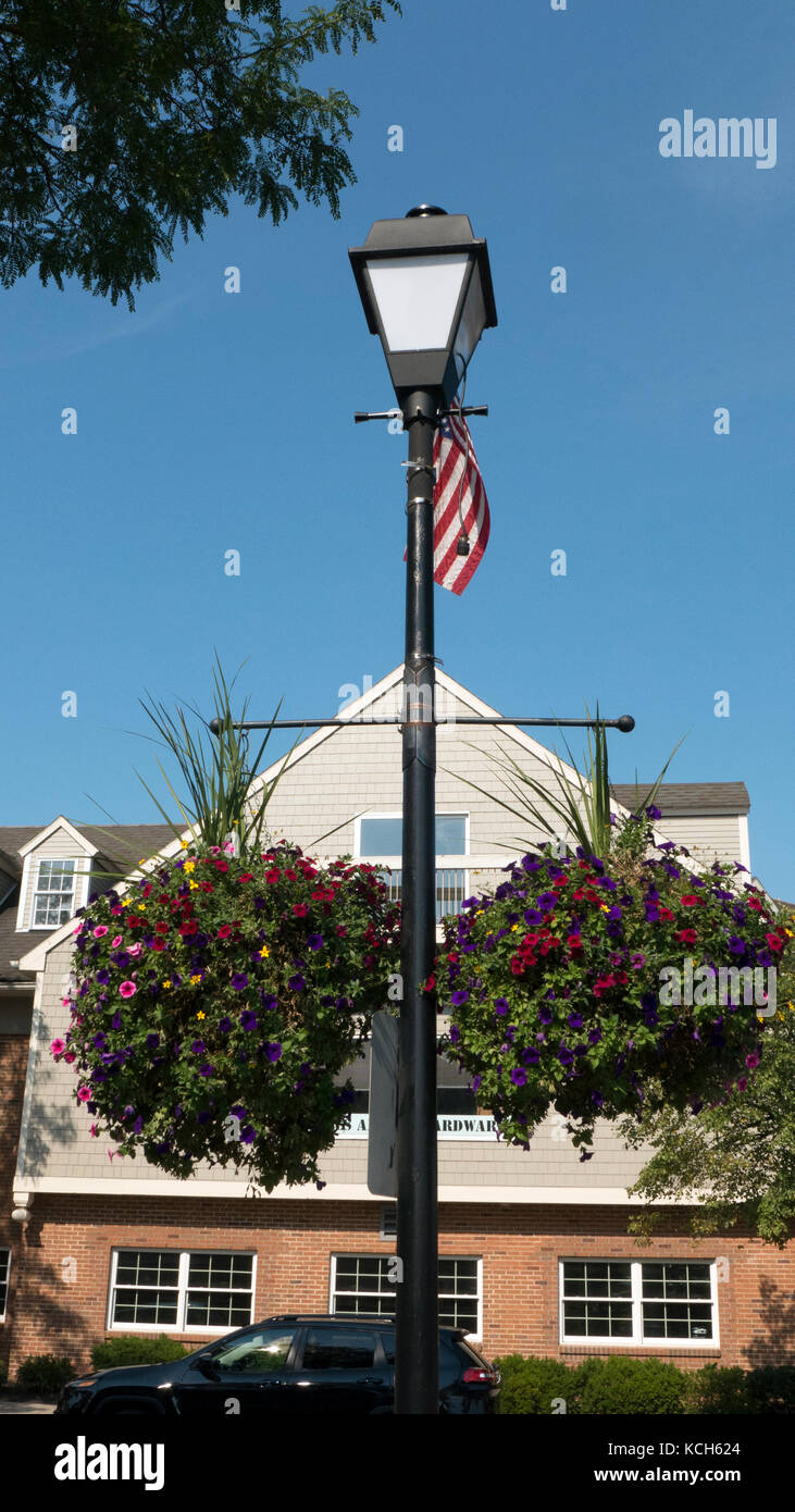 Lamp post with flag, Fairport NY Stock Photo - Alamy