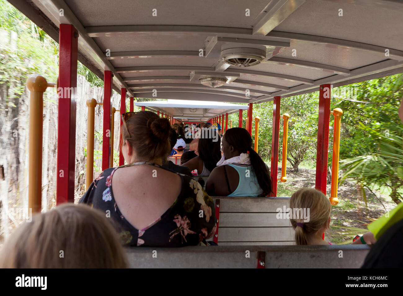 Passengers on a ridable miniature train (ridable miniature railway aka ...