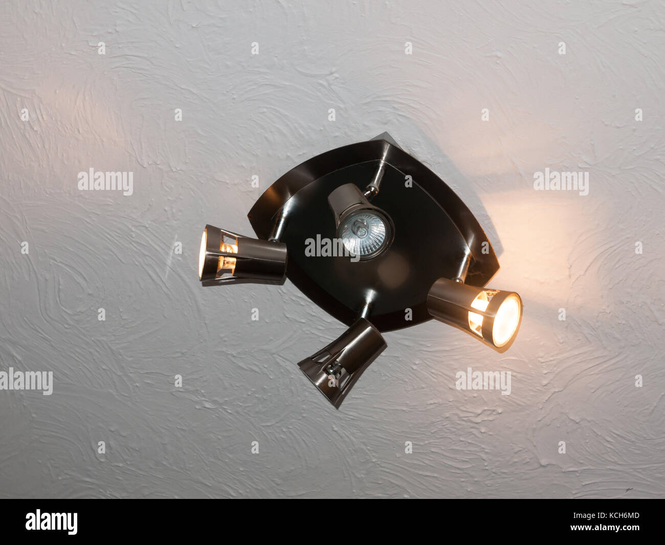 four headed metal shiny lamp ceiling up above on; essex; england; uk ...