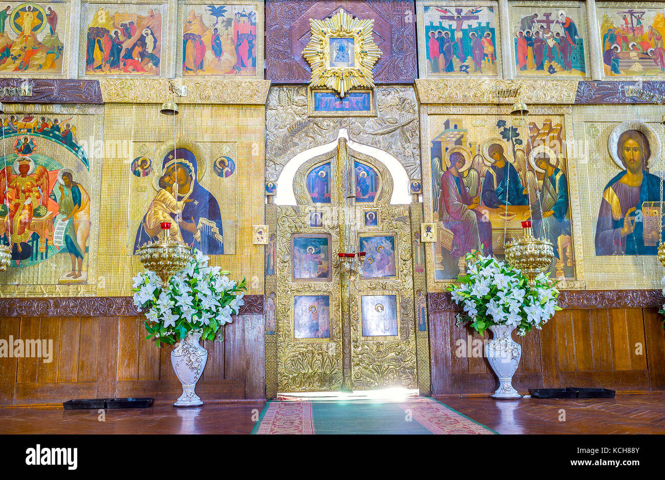 POCHAYIV, UKRAINE - AUGUST 30, 2017: The golden Royal doors in iconostasis of Holy Trinity ...