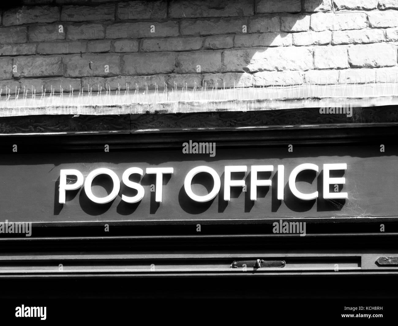 Post office sign above branch entrance Stock Photo - Alamy