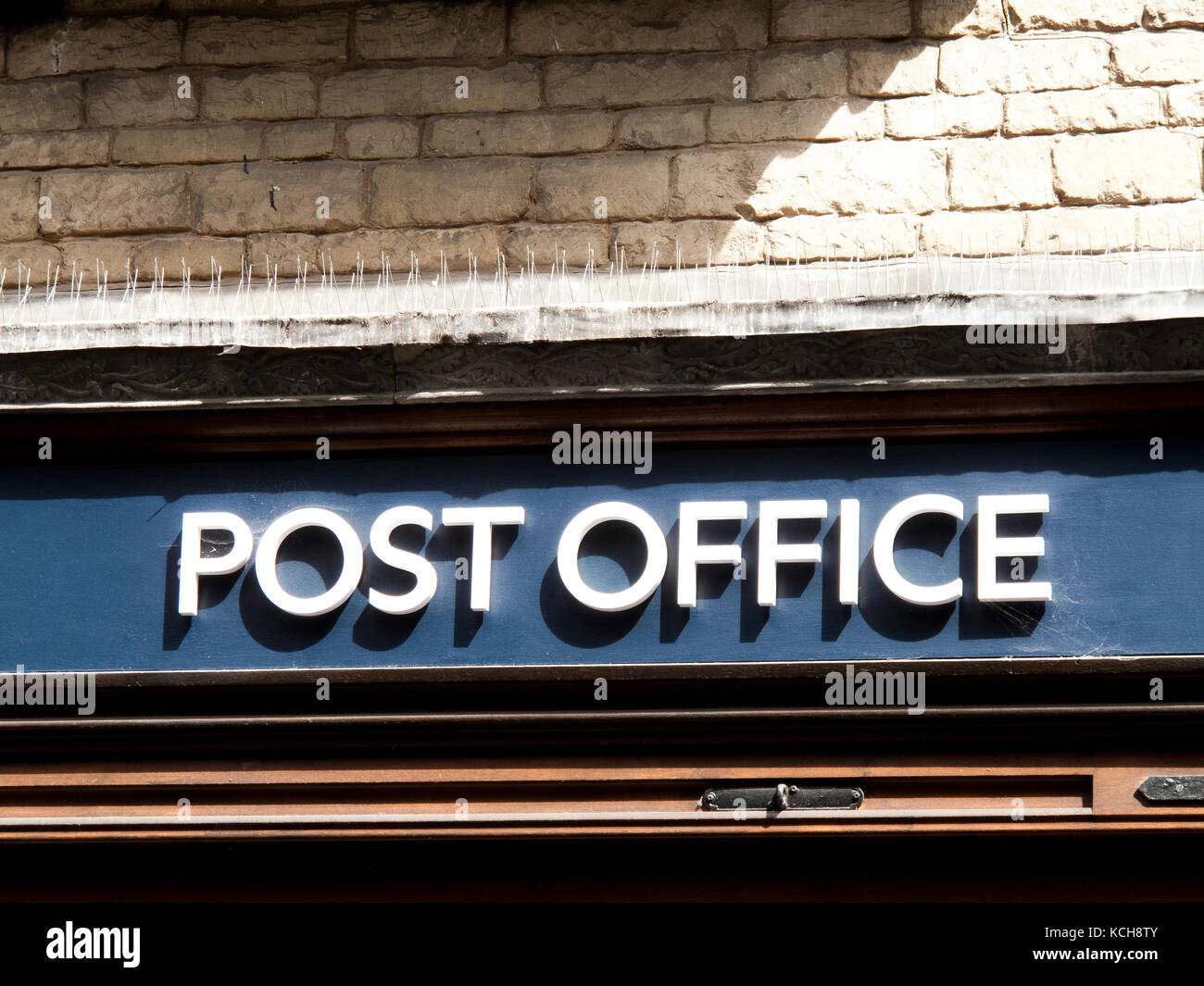 Post office sign above branch entrance Stock Photo - Alamy