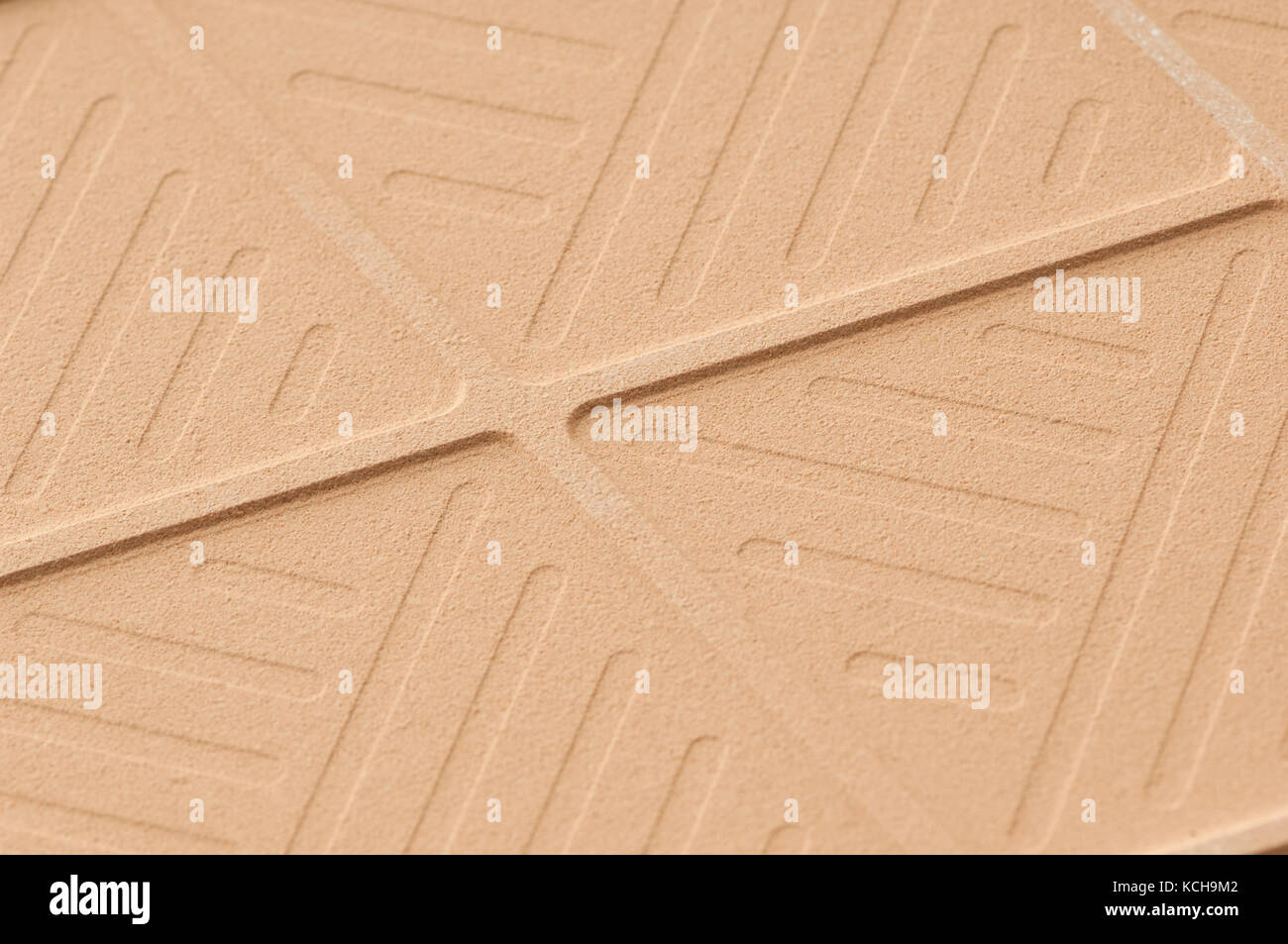 background of ceramic tiles with square ribs of brown color. ridge ...