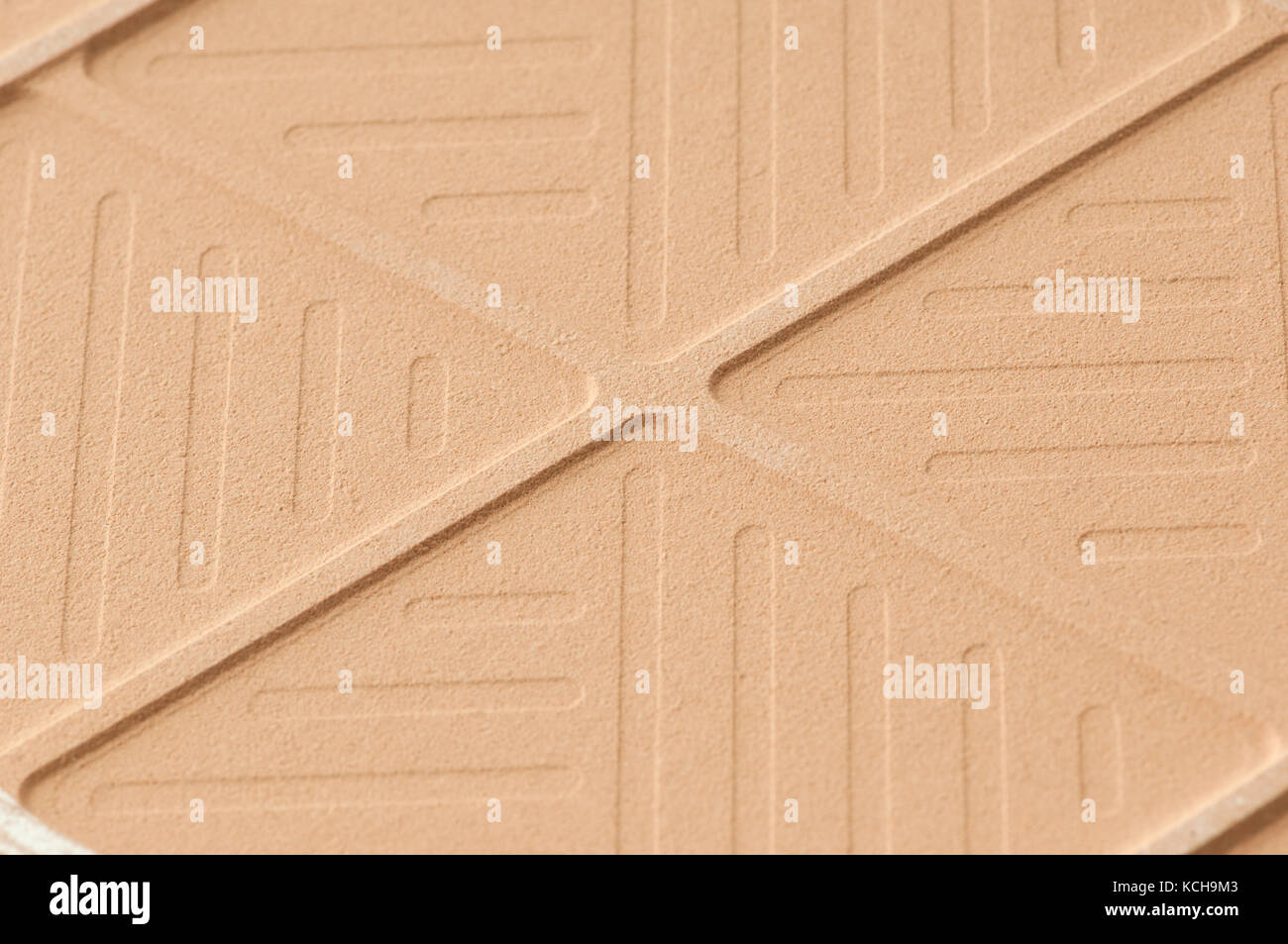 background of ceramic tiles with square ribs of brown color. ridge ...