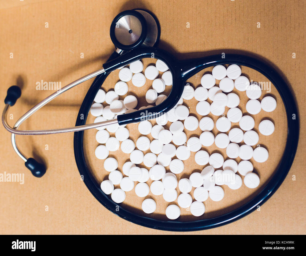 White medical tablet medicine and stethoscope Stock Photo - Alamy