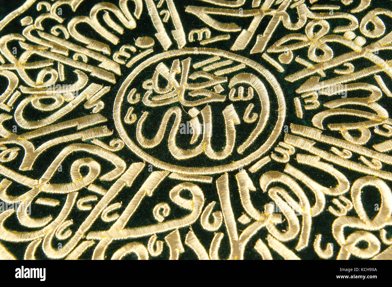 background fabrics and textiles with inscriptions in Arabic gold color ...