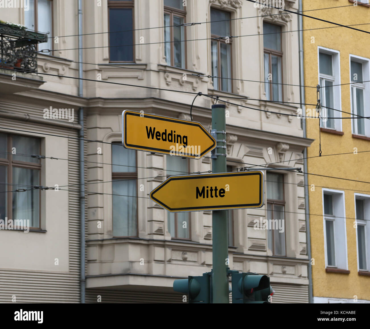 two yellow road signs with the arrow and the indications of the two ...