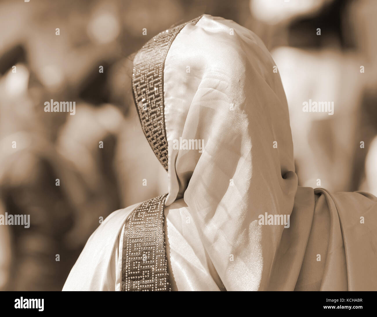 woman with veil over her head with sepia tone effect Stock Photo - Alamy