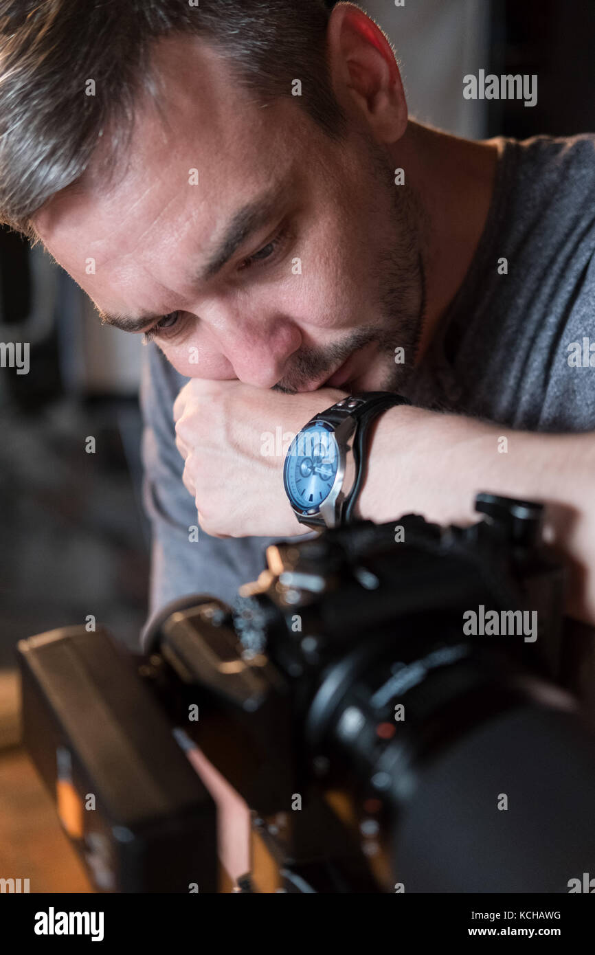 a young photographer exploring the camera closeup Stock Photo - Alamy