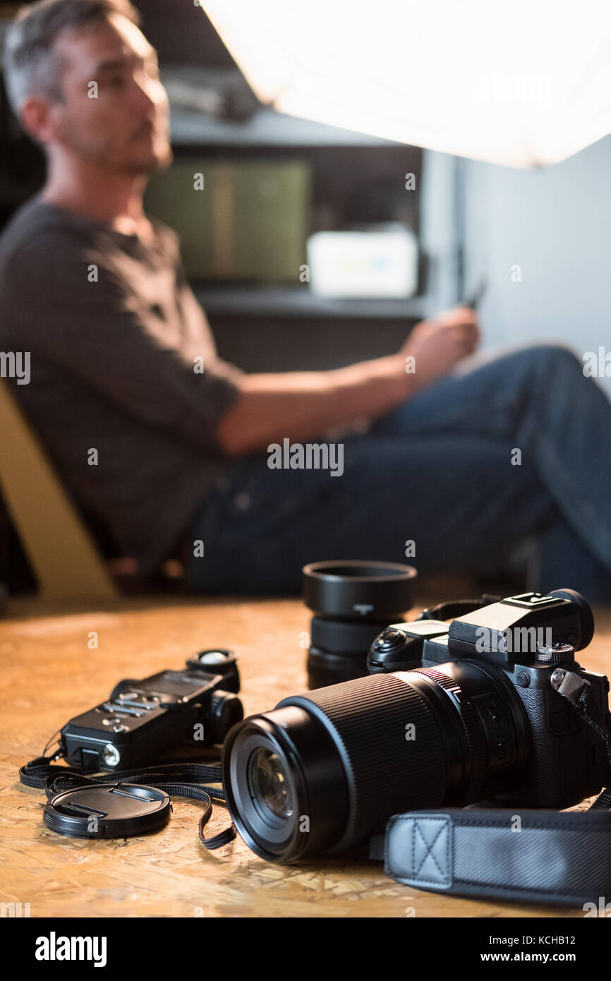camera and equipment on the table in the Studio in the background of ...