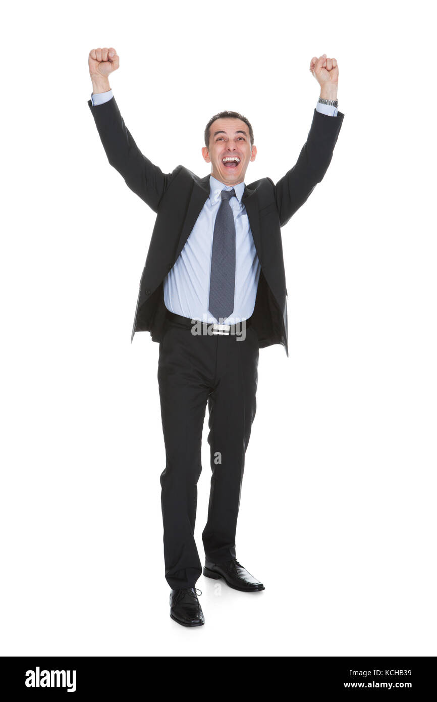 Portrait Of Excited Businessman Raising Hands Over White Background ...