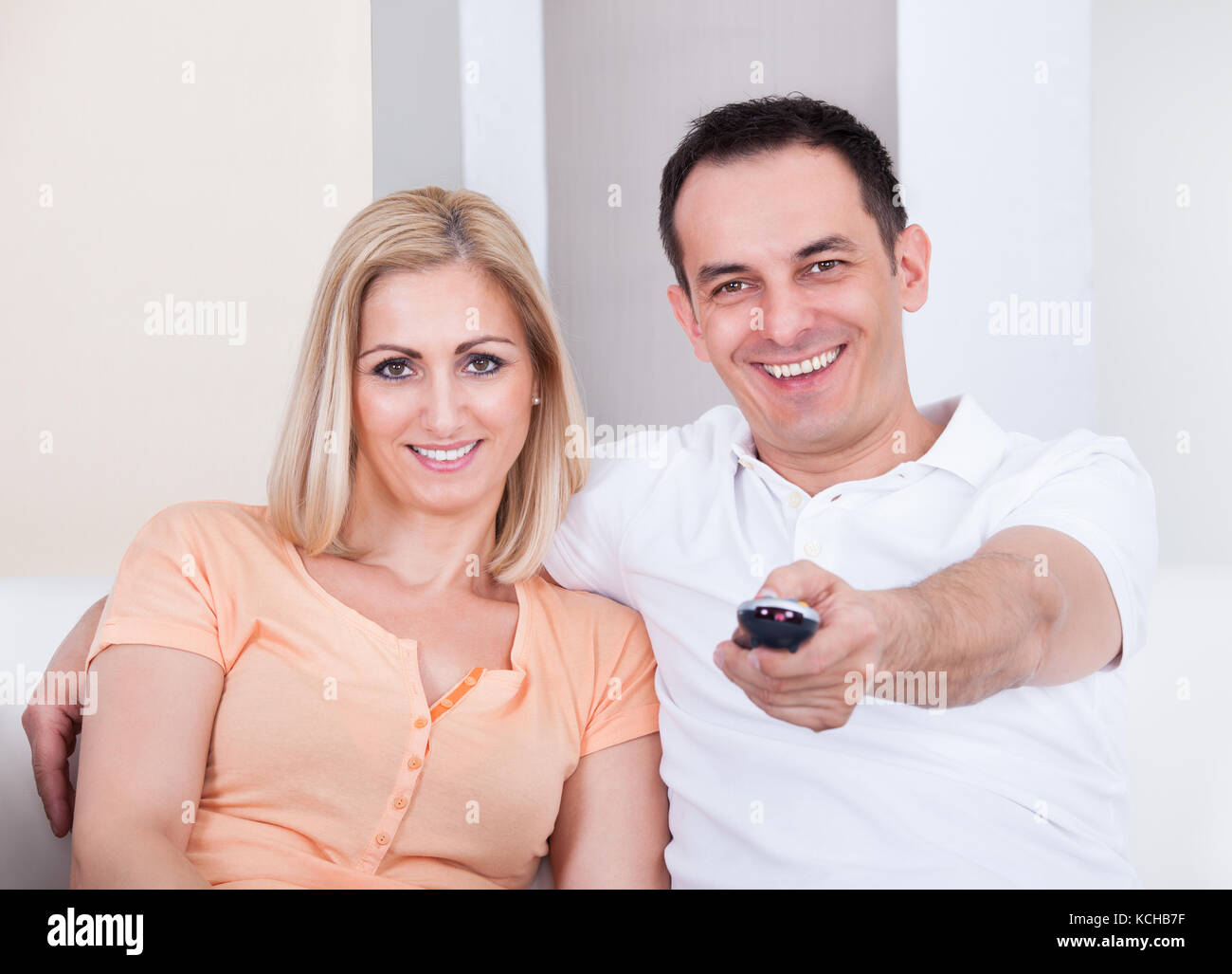 Tv program remote control couple hi-res stock photography and images ...