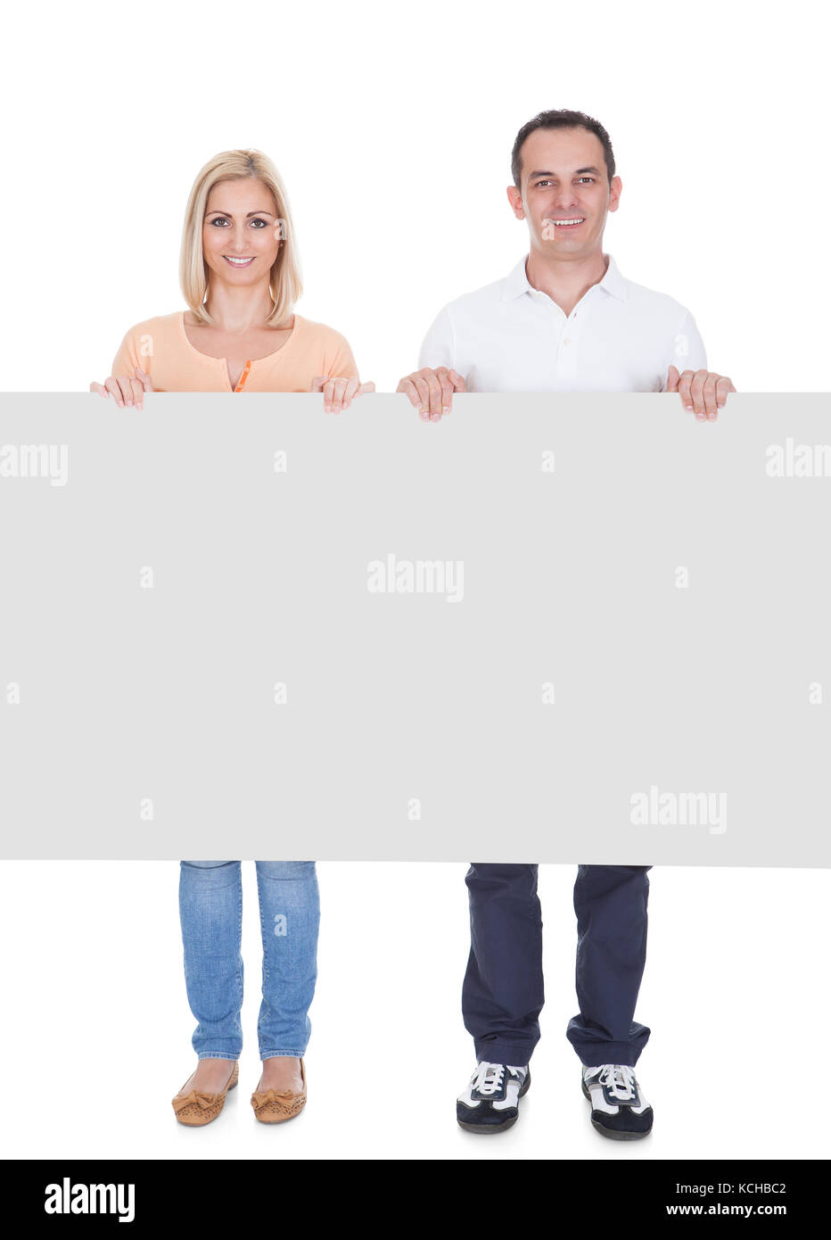 Happy Couple Holding Blank Placard Over White Background Stock Photo ... Happy Couple Holding Blank Placard Over White Background Stock Photo ...